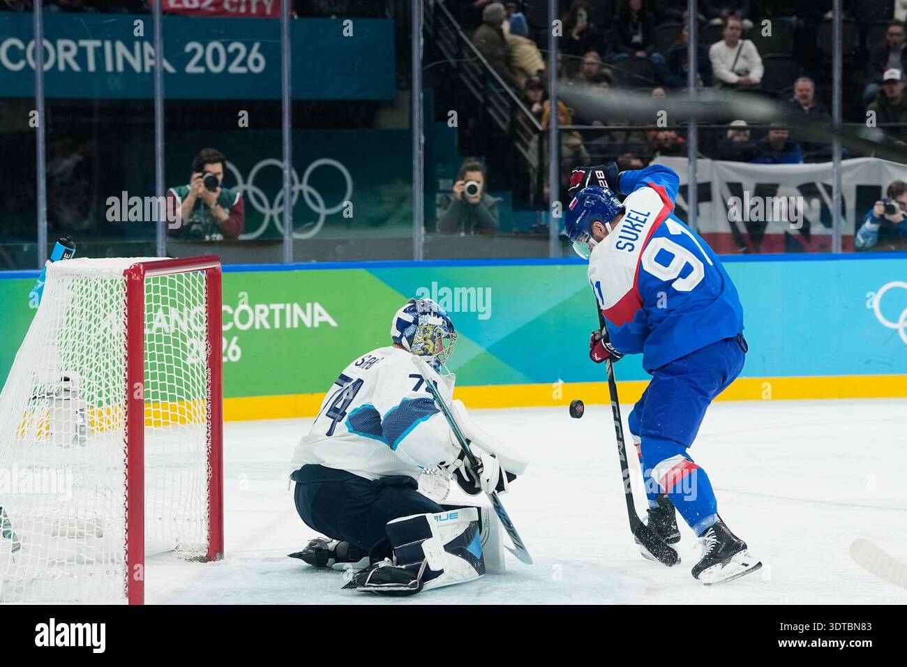 Finland's goalkeeper Juuse Saros (74) blocks a shot from Slovakia's ...