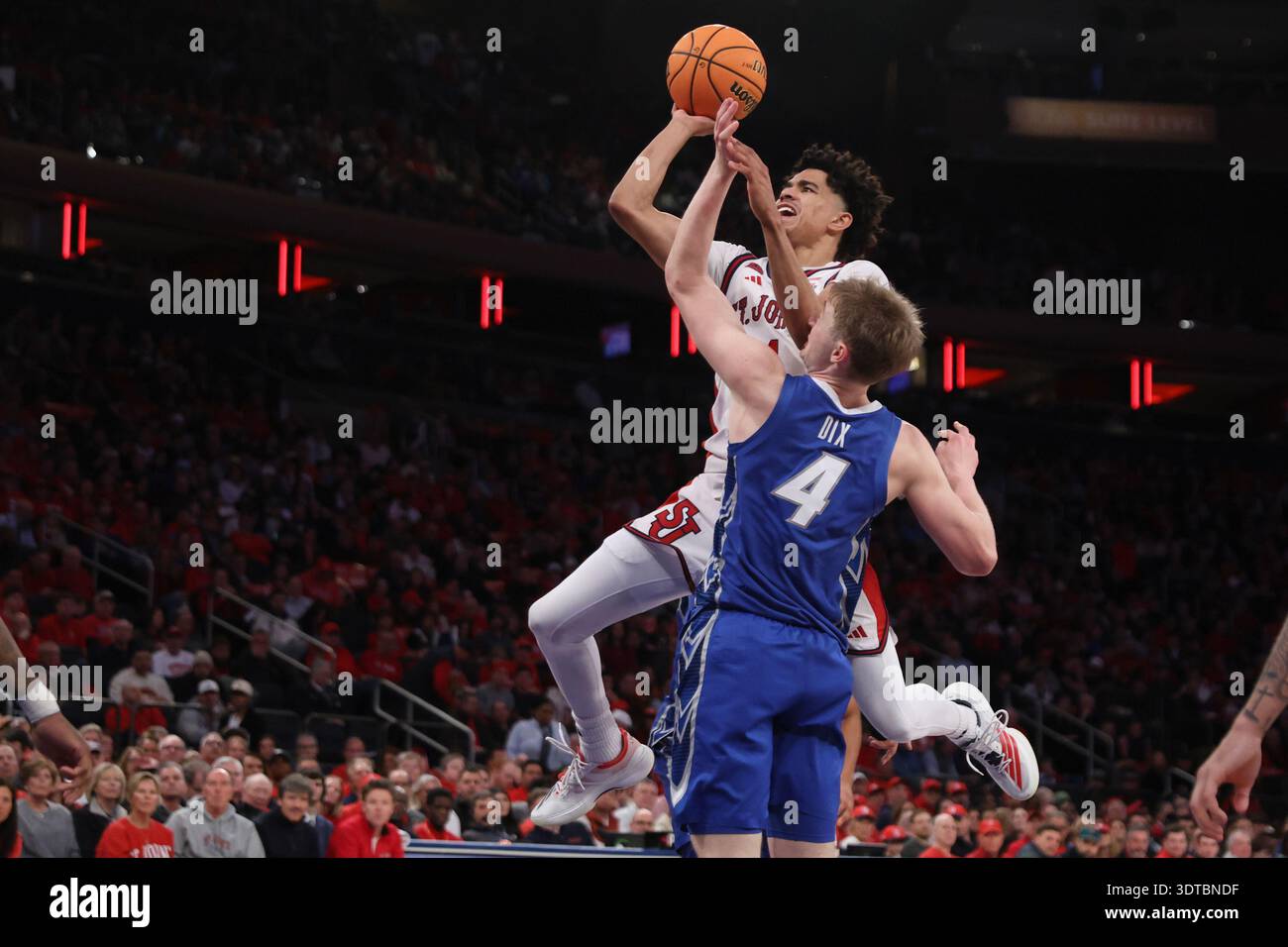 St. John's guard Oziyah Sellers drives to the basket past Creighton ...