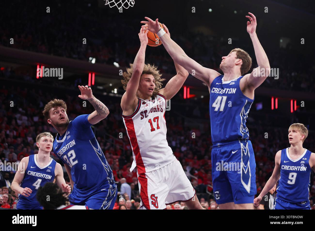 St. John's forward Rubén Prey (17) grabs a rebound over Creighton ...
