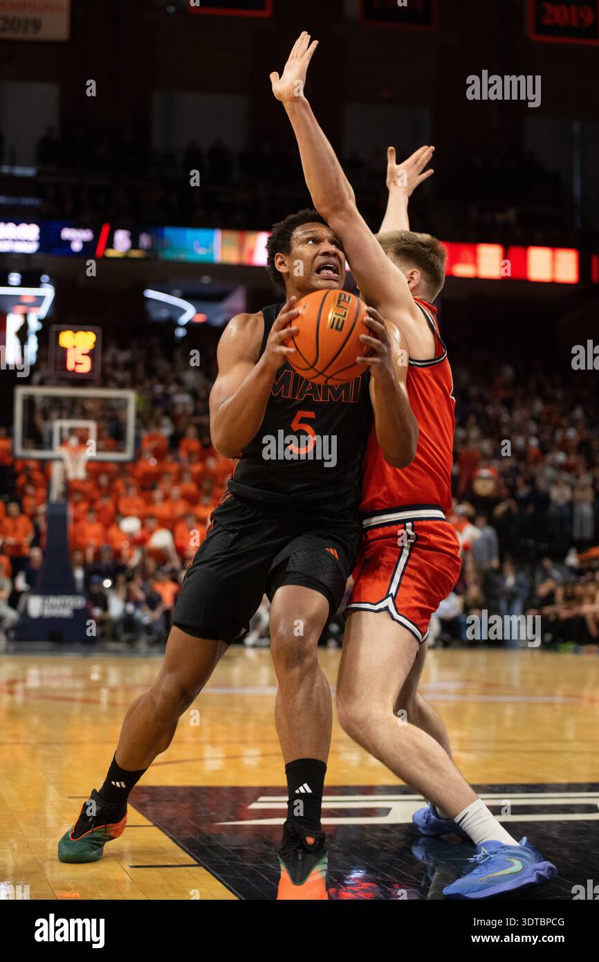 Miami forward Malik Reneau (5) is stopped by Virginia forward Thijs de ...