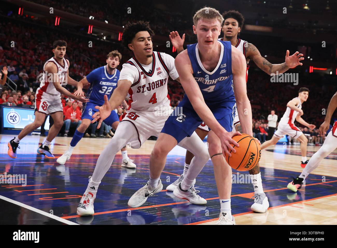 Creighton guard Josh Dix (4) is defended by St. John's guard Oziyah ...