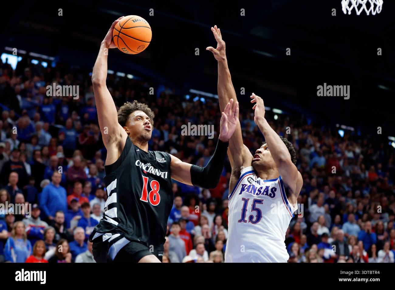 Cincinnati forward Baba Miller (18) attempts to score over Kansas ...