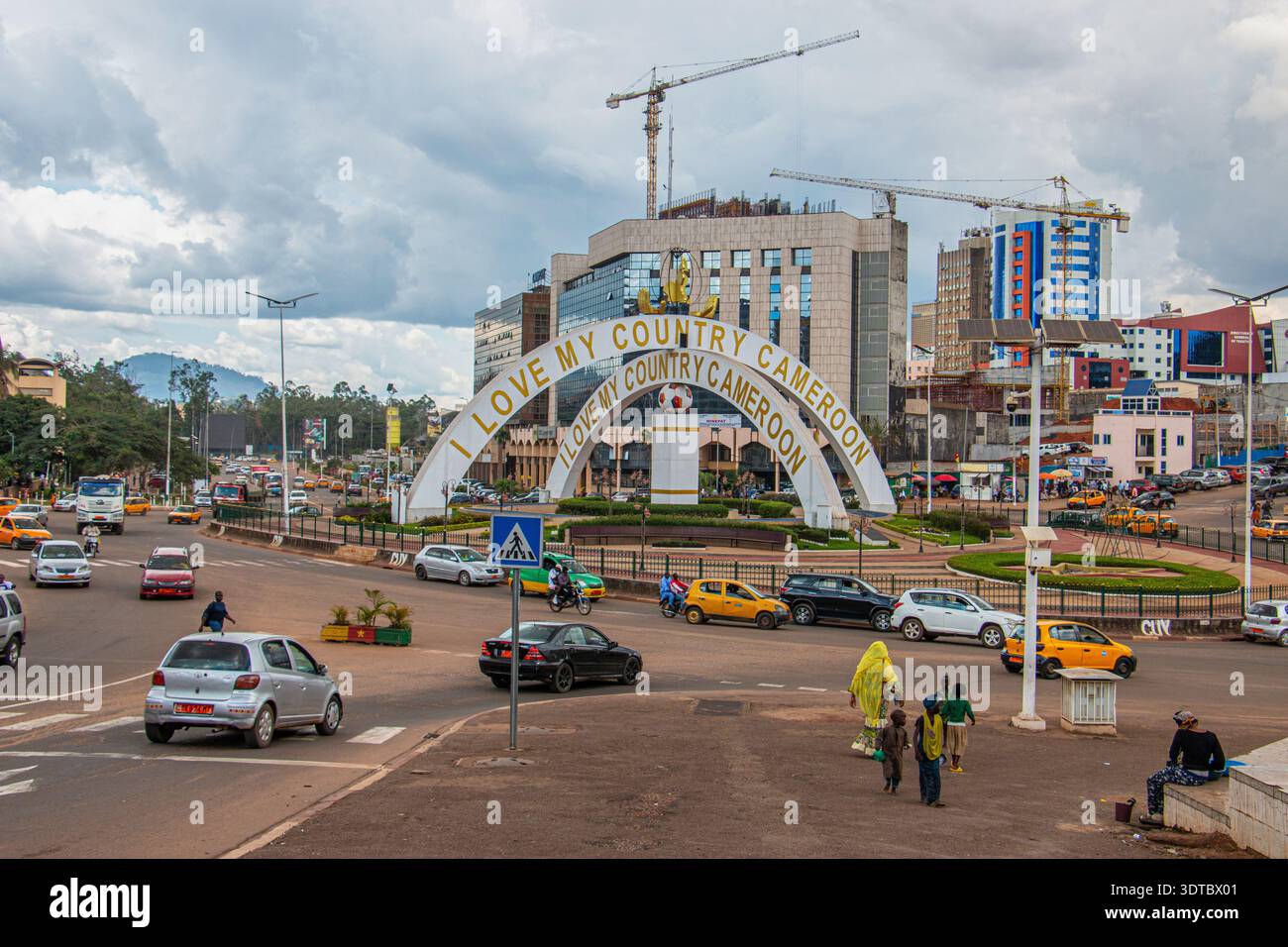 FILE - Cars drive through an intersection near a monument in Yaoundé ...