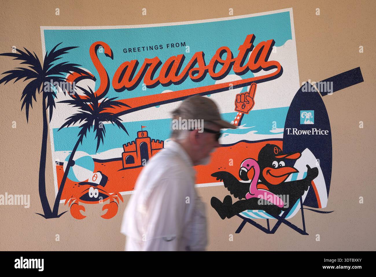 A fan walks through Ed Smith Stadium before a spring training baseball ...