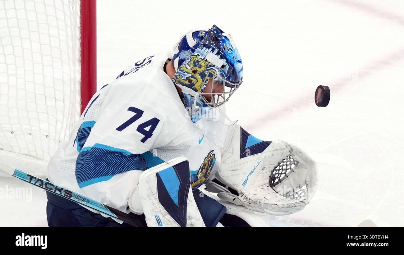 Finland goalkeeper Juuse Saros (74) blocks a shot by Slovakia's Matus ...