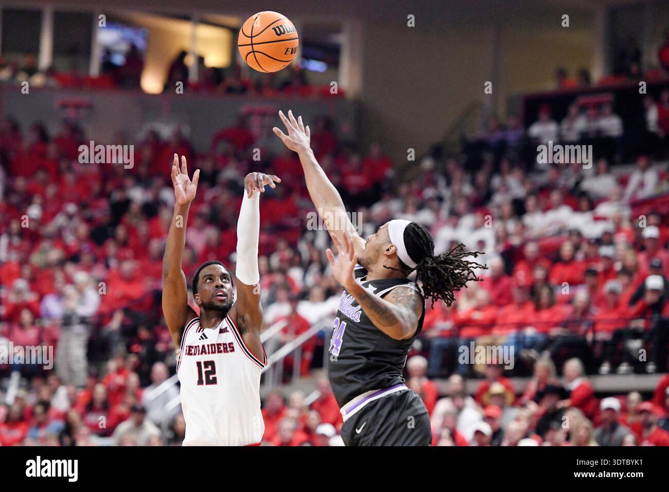 Texas Tech forward Donovan Atwell (12) shoots a 3-pointer while Kansas ...