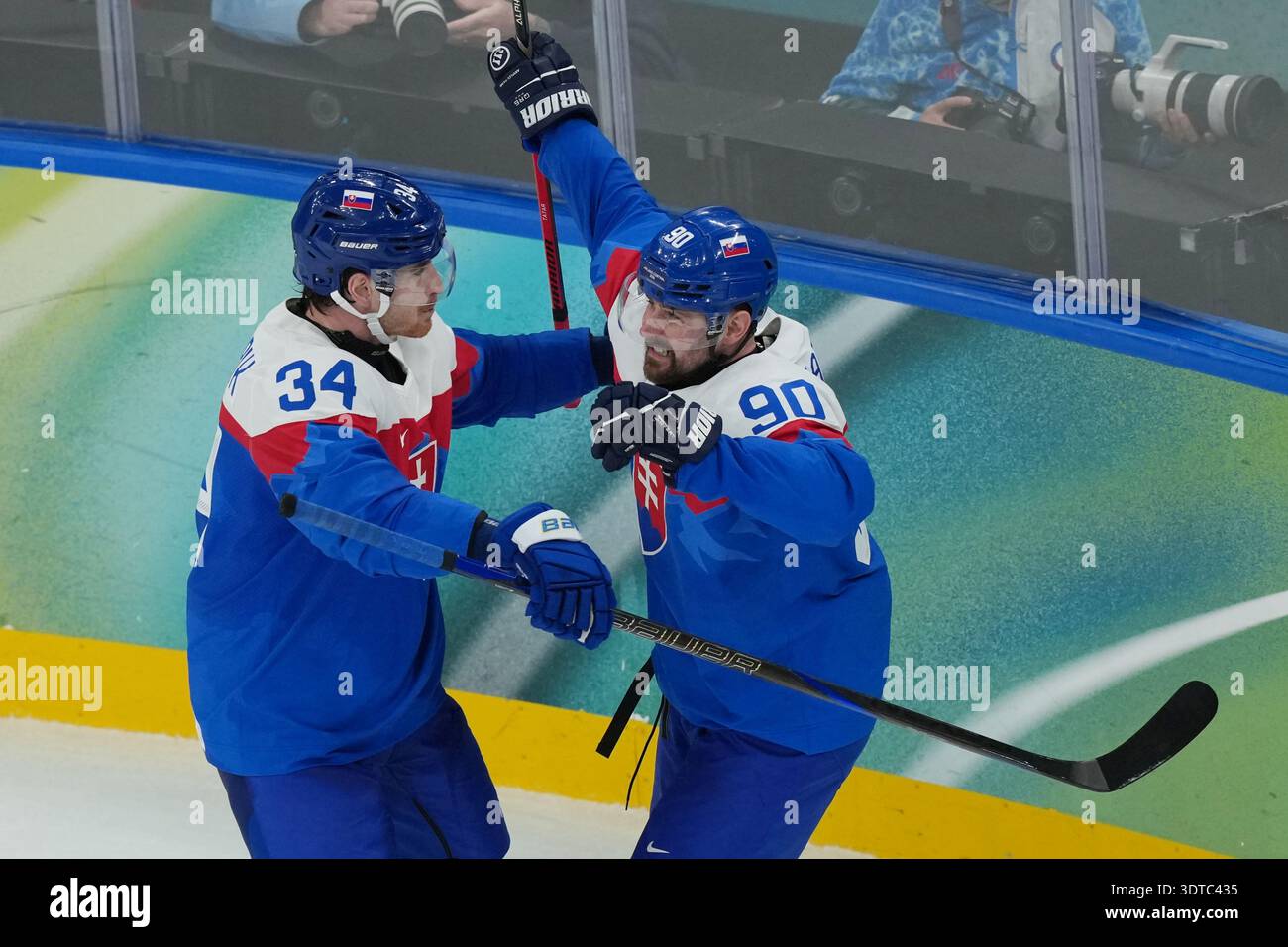 Slovakia's Tomas Tatar (90) celebrates with Peter Cehlarik (34) after ...