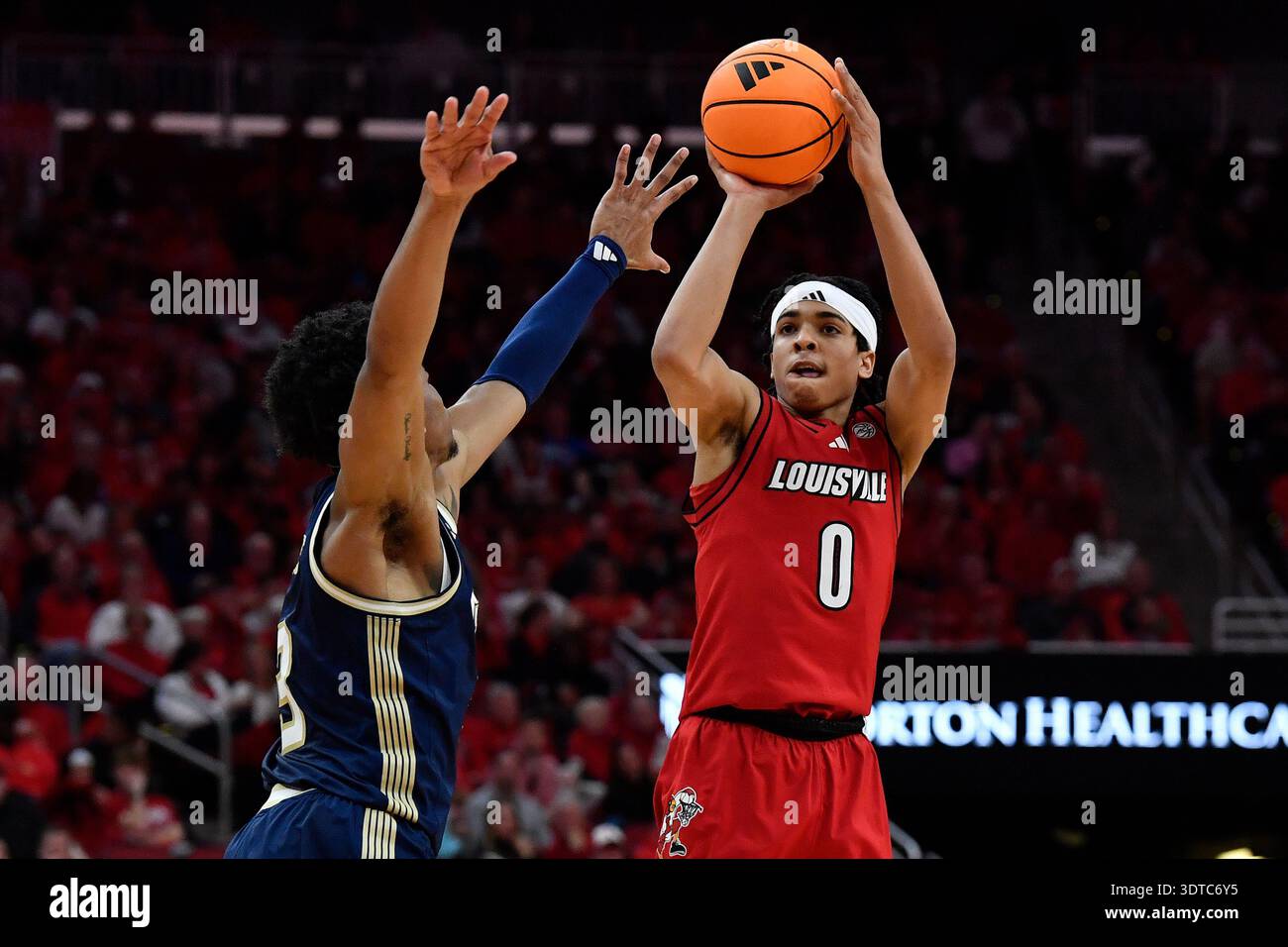 Louisville guard Mikel Brown Jr. (0) shoots over Georgia Tech guard ...