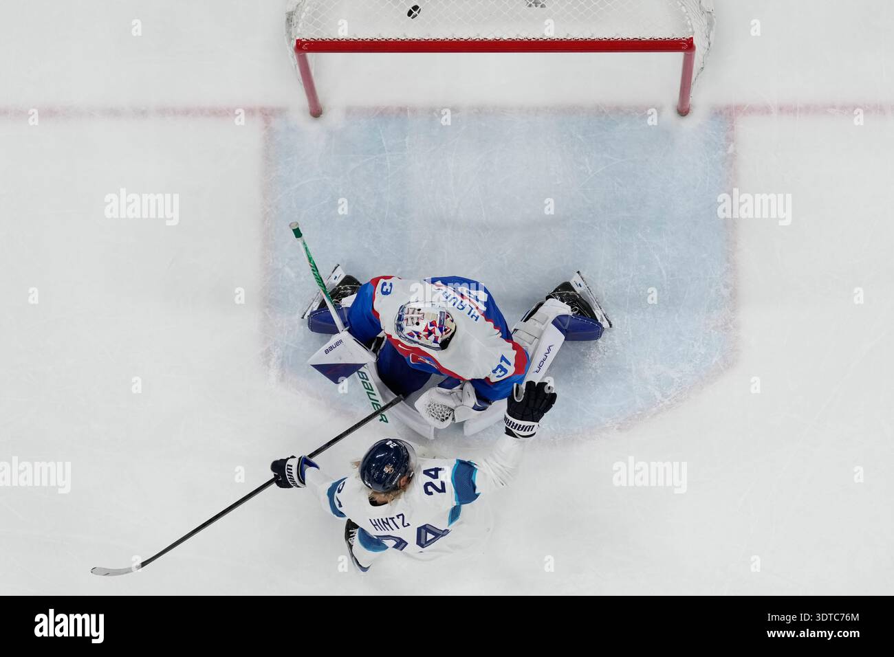 Finland's Roope Hintz (24) scores his side's third goal during a men's ...