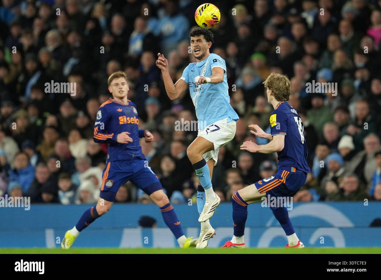 Manchester City's Matheus Nunes heads the ball in front of Newcastle's ...