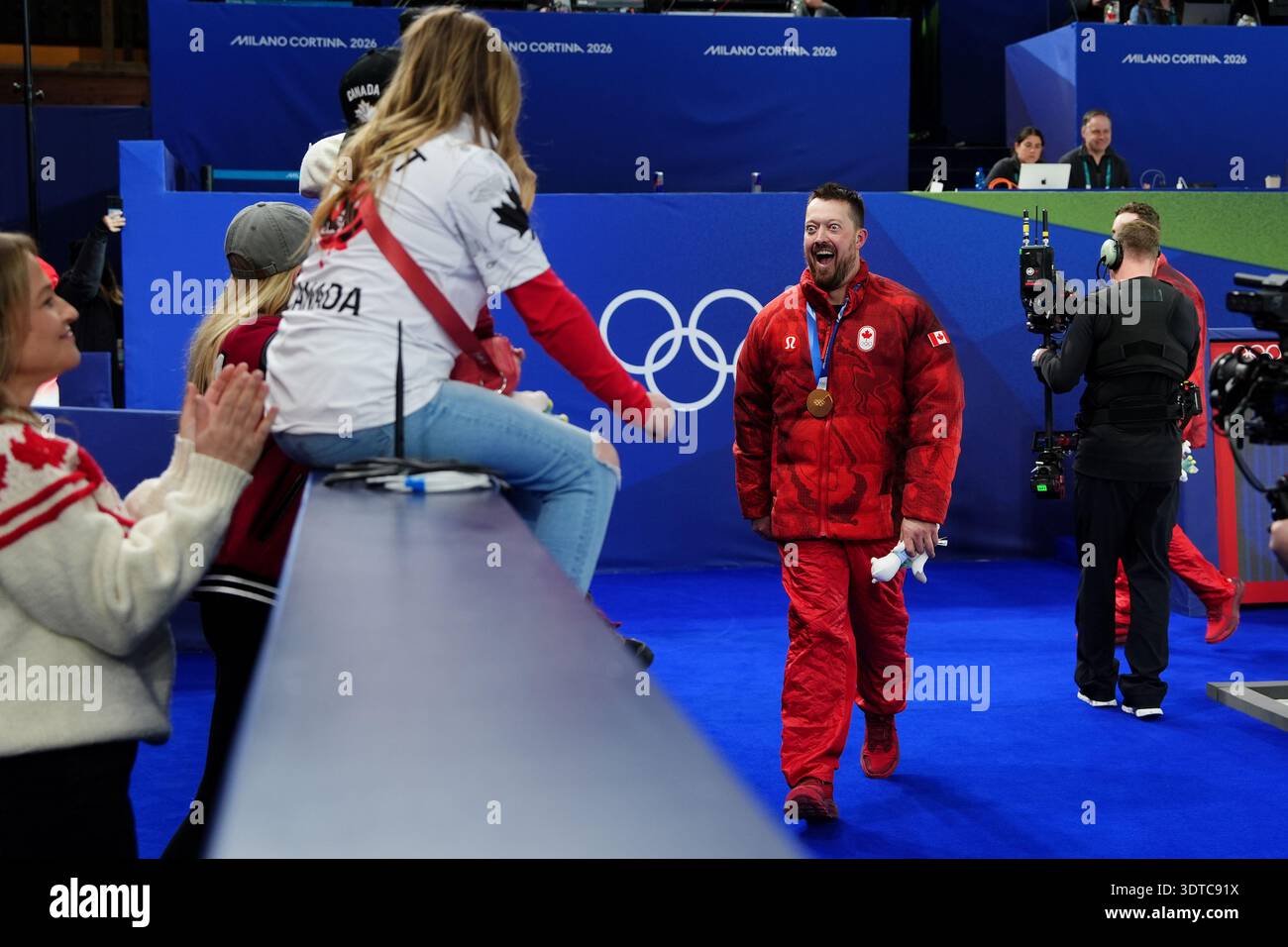 Canada's Ben Hebert (right) celebrates with family after the Men's ...