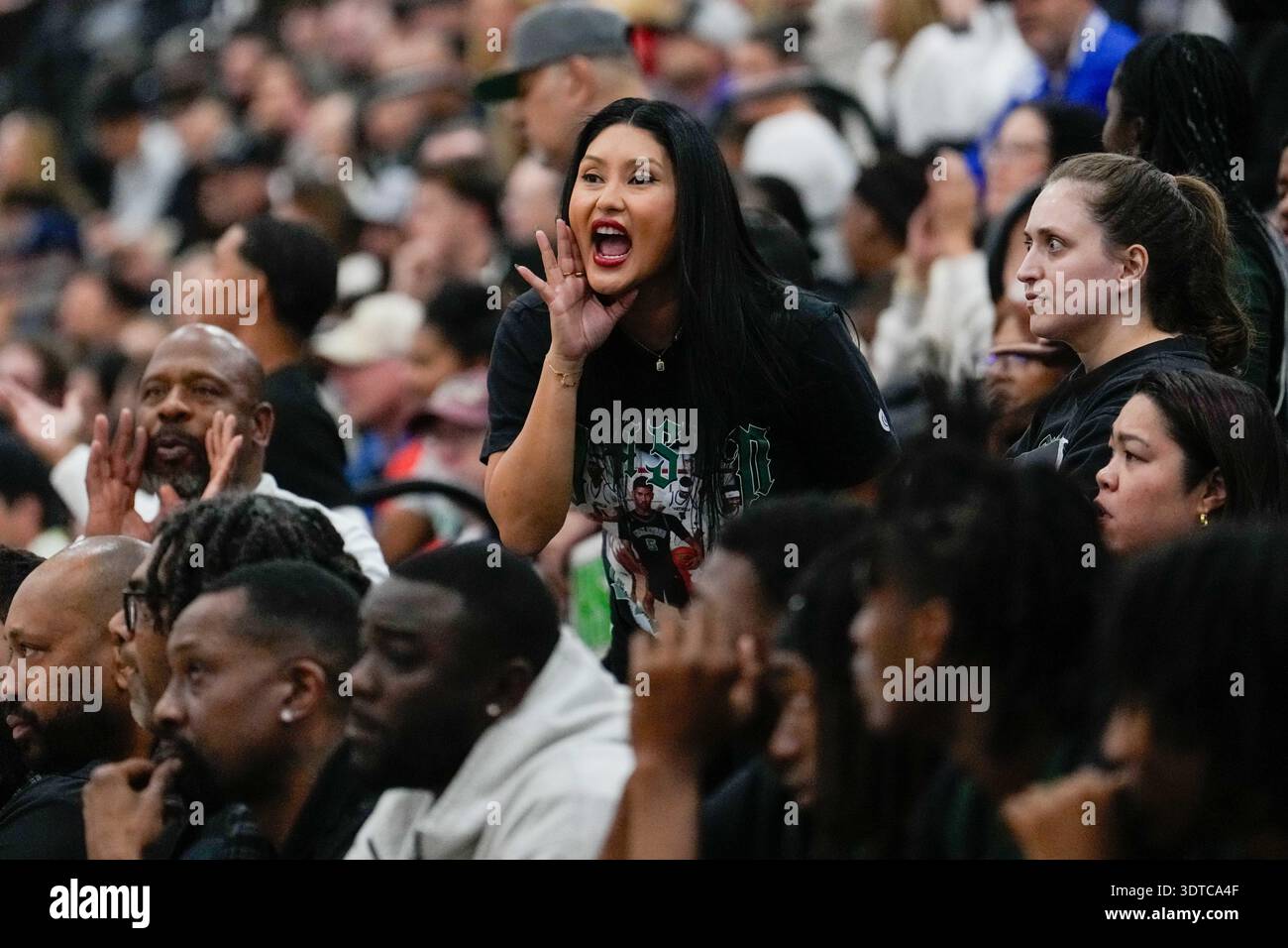 Irene Crowe, mother of Jason Crowe Jr, attends a high school basketball ...