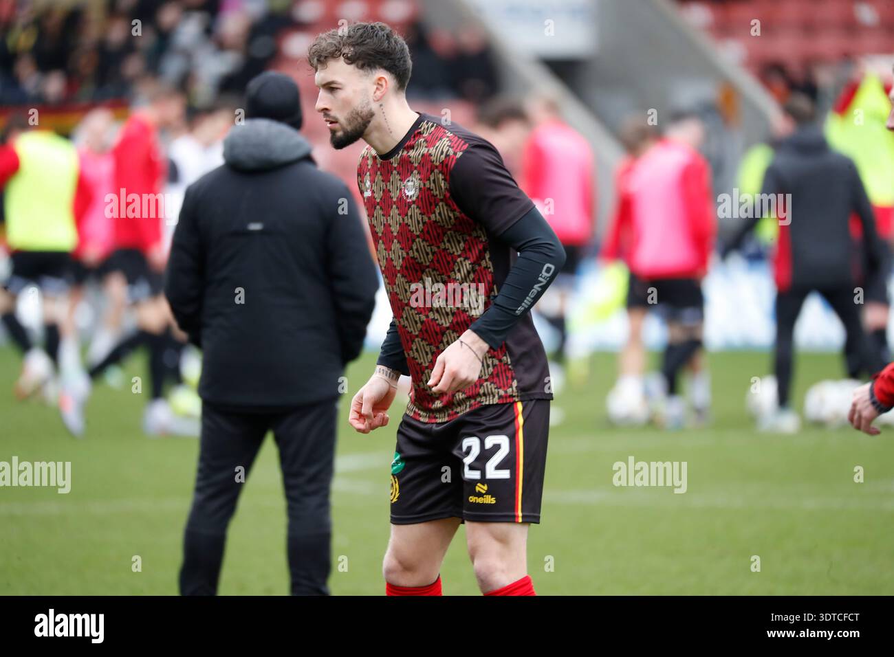 Partick Thistle's Cale Loughrey (#22) warms up before kickoff of the ...