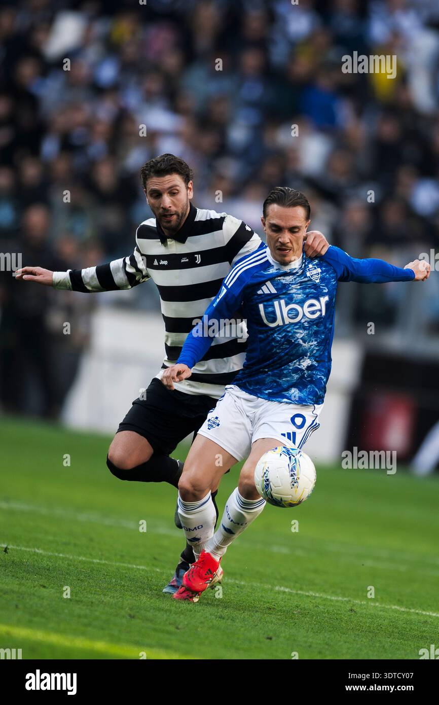 Maxence Caqueret of Como 1907 competes for the ball with Manuel ...
