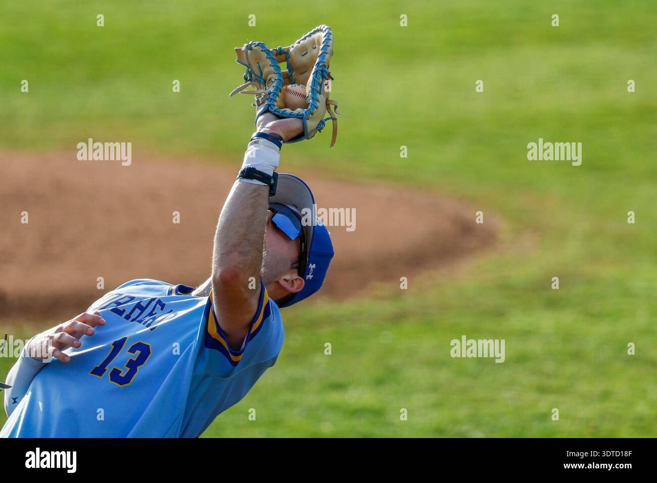 Morehead State first baseman Alex Kean catches a pop fly during an NCAA ...