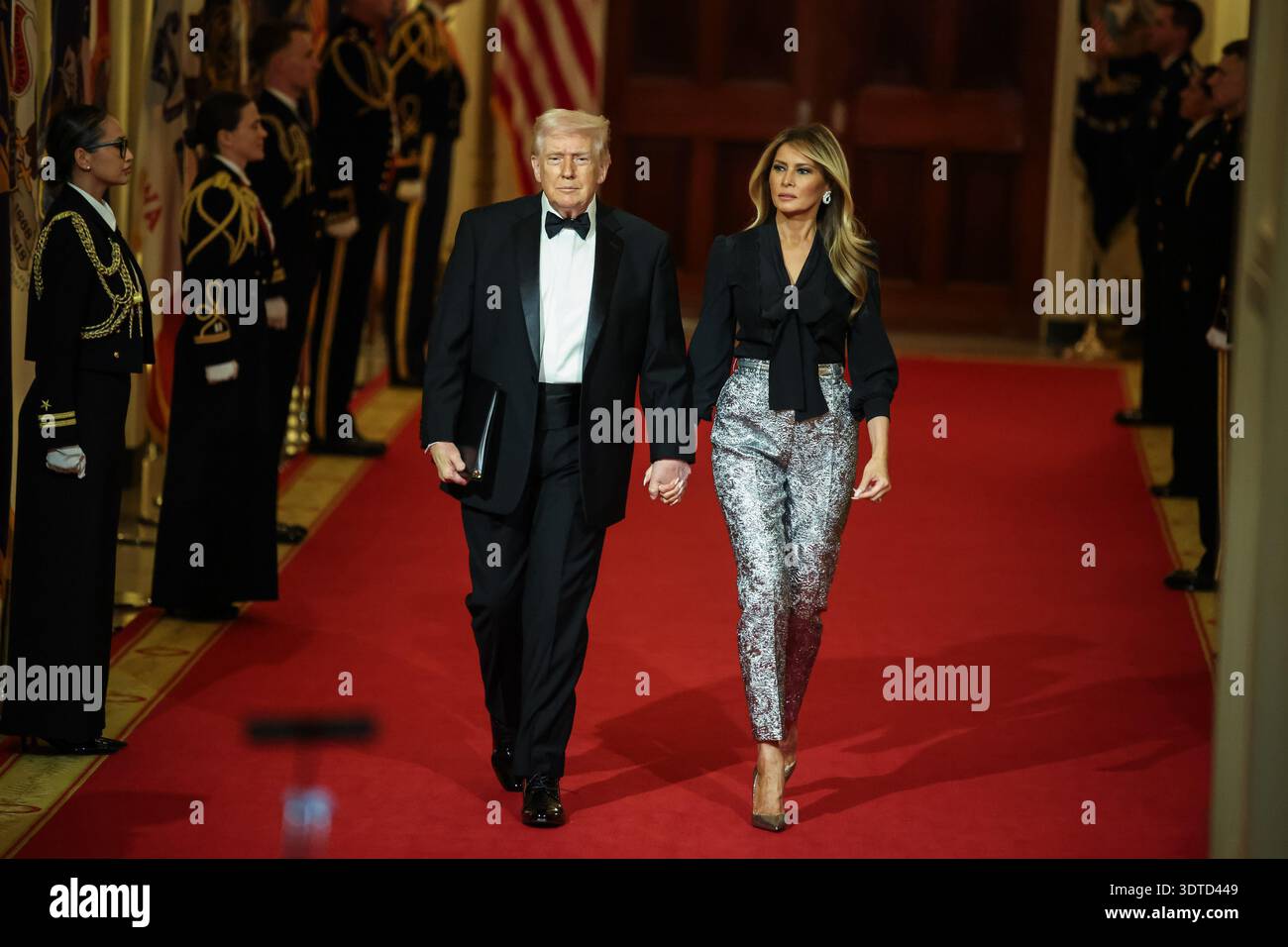 U.S. President Donald Trump and First Lady Melania Trump walk down the ...