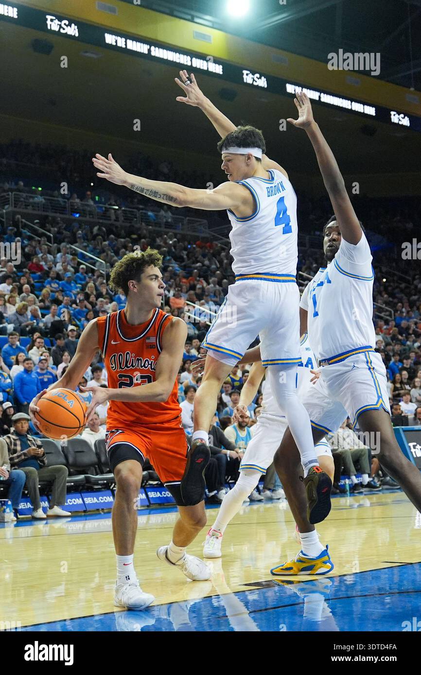 Illinois guard Keaton Wagler (23) is guarded by UCLA guard Jamar Brown ...