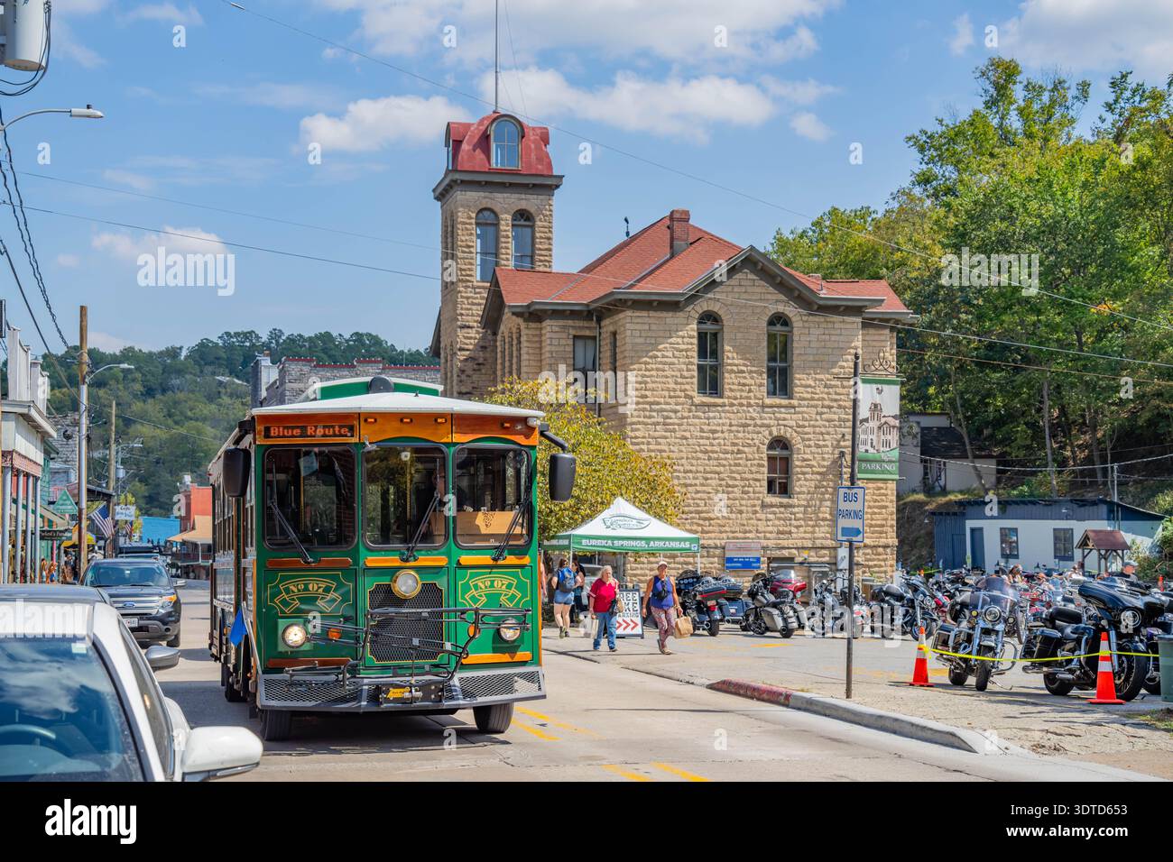 Arkansas, SEP 21 2024 - A green and orange vintage trolley labeled blue ...