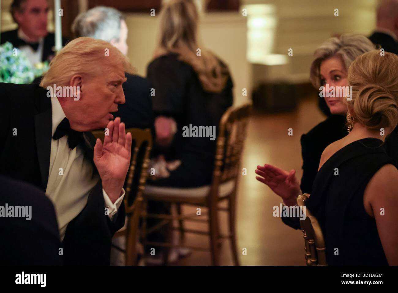 U.S. President Donald Trump turns to talk with White House Chief of ...
