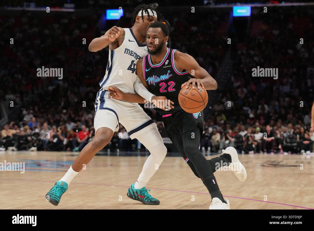 Miami Heat forward Andrew Wiggins (22) drives to the basket as Memphis ...