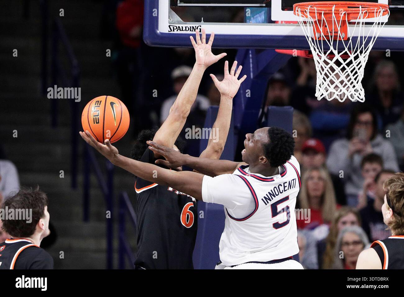 Gonzaga forward Emmanuel Innocenti (5) drives to the basket and is ...