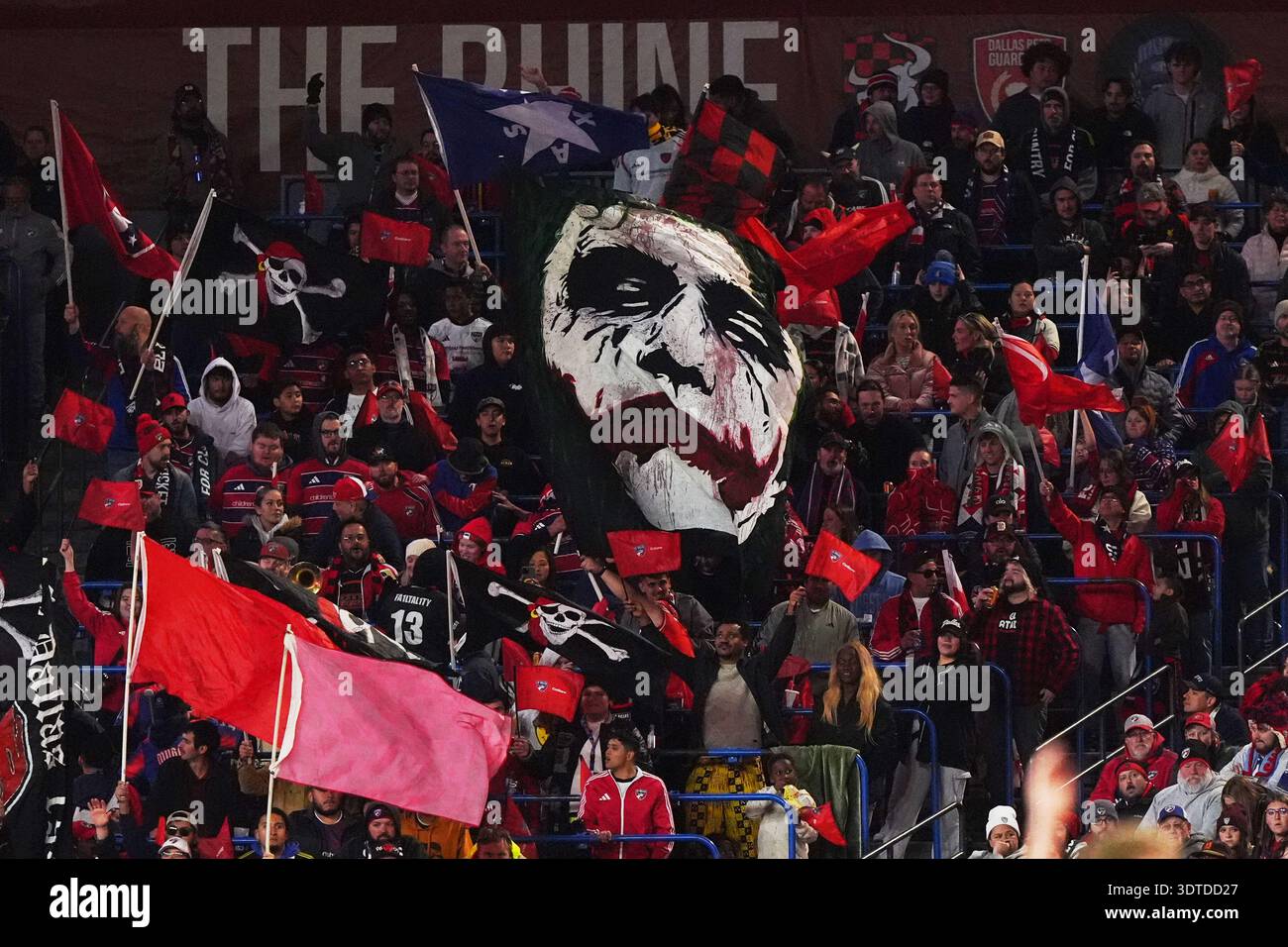 Fans in the stands wave flags during the first half of an MLS soccer ...