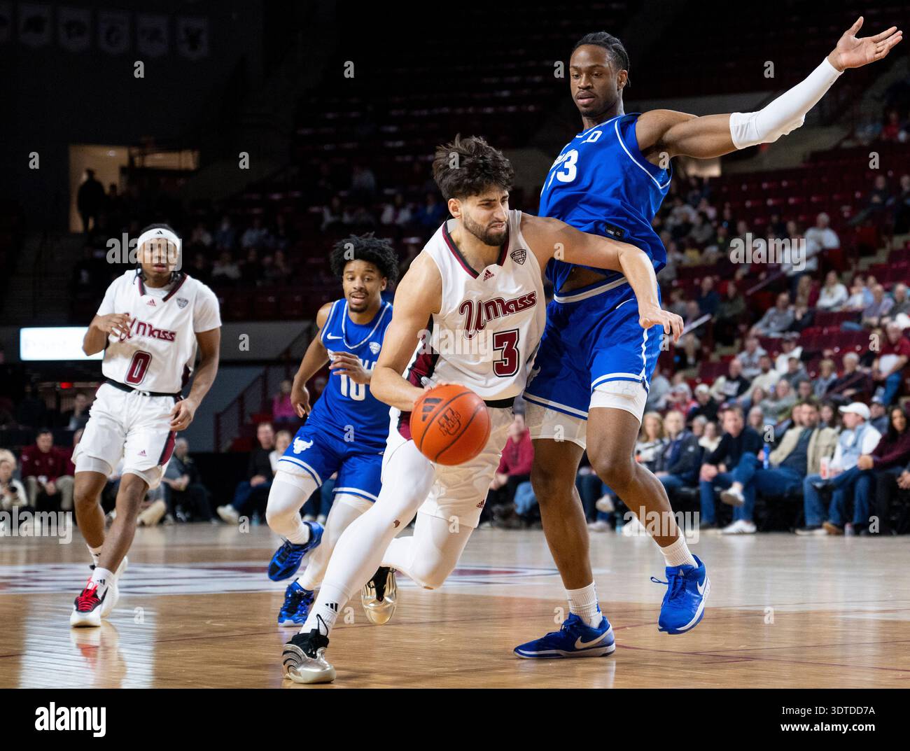 Massachusetts forward Leonardo Bettiol (3) attempts to dribble around ...