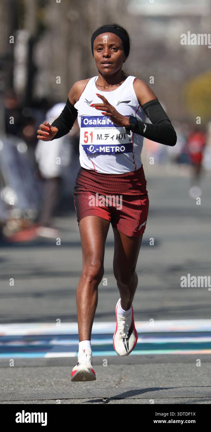 Mare Dibaba Hurrsa crosses the finish line as the first runner during ...