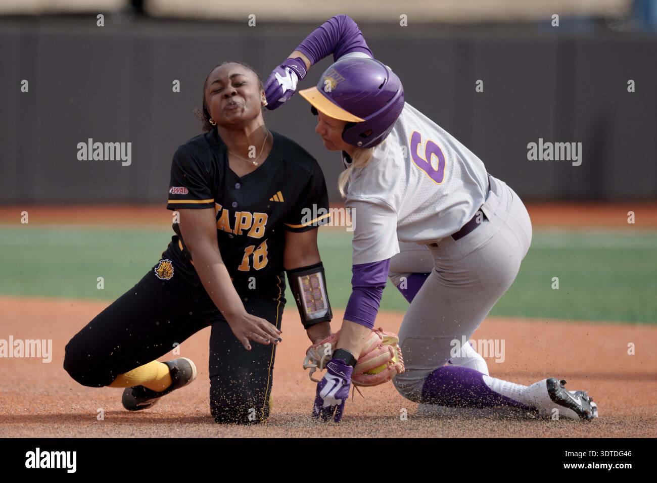 Northern Iowa outfielder Paige Peterson (6) collides with Arkansas-Pine ...