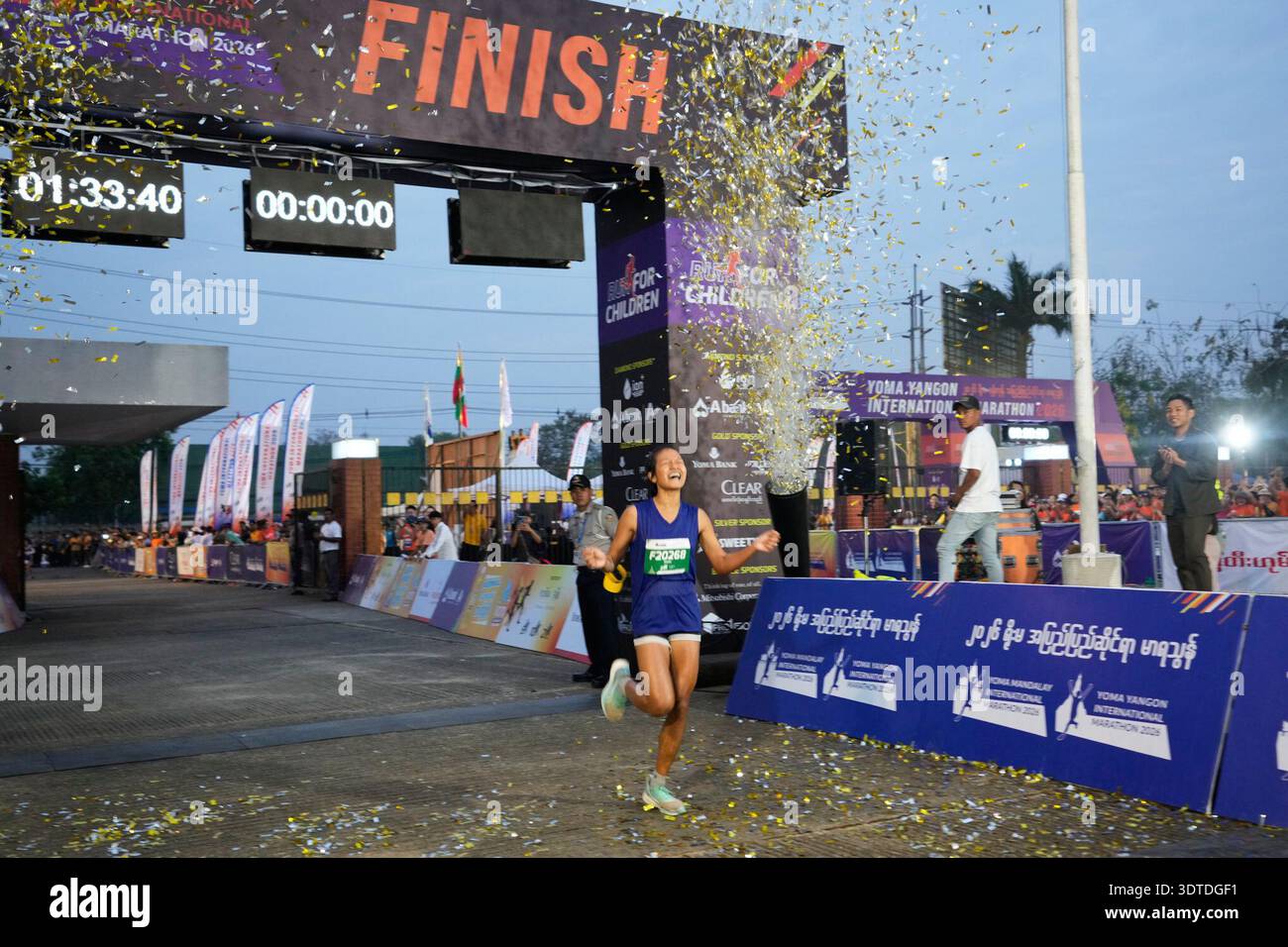 A competitor crosses the finish line of the Yoma Yangon International ...