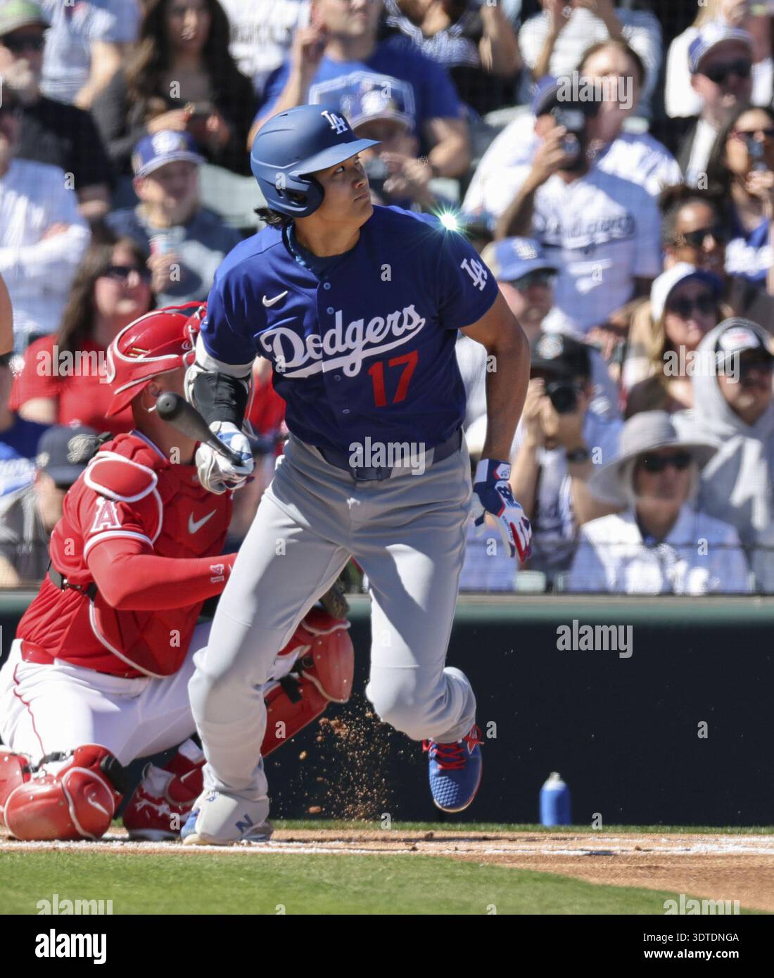Los Angeles Dodgers two-way player Shohei Ohtani hits an infield single ...