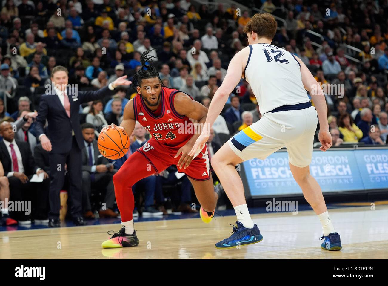 St. John's' Zuby Ejiofor drives to the basket against Marquette's Ben ...