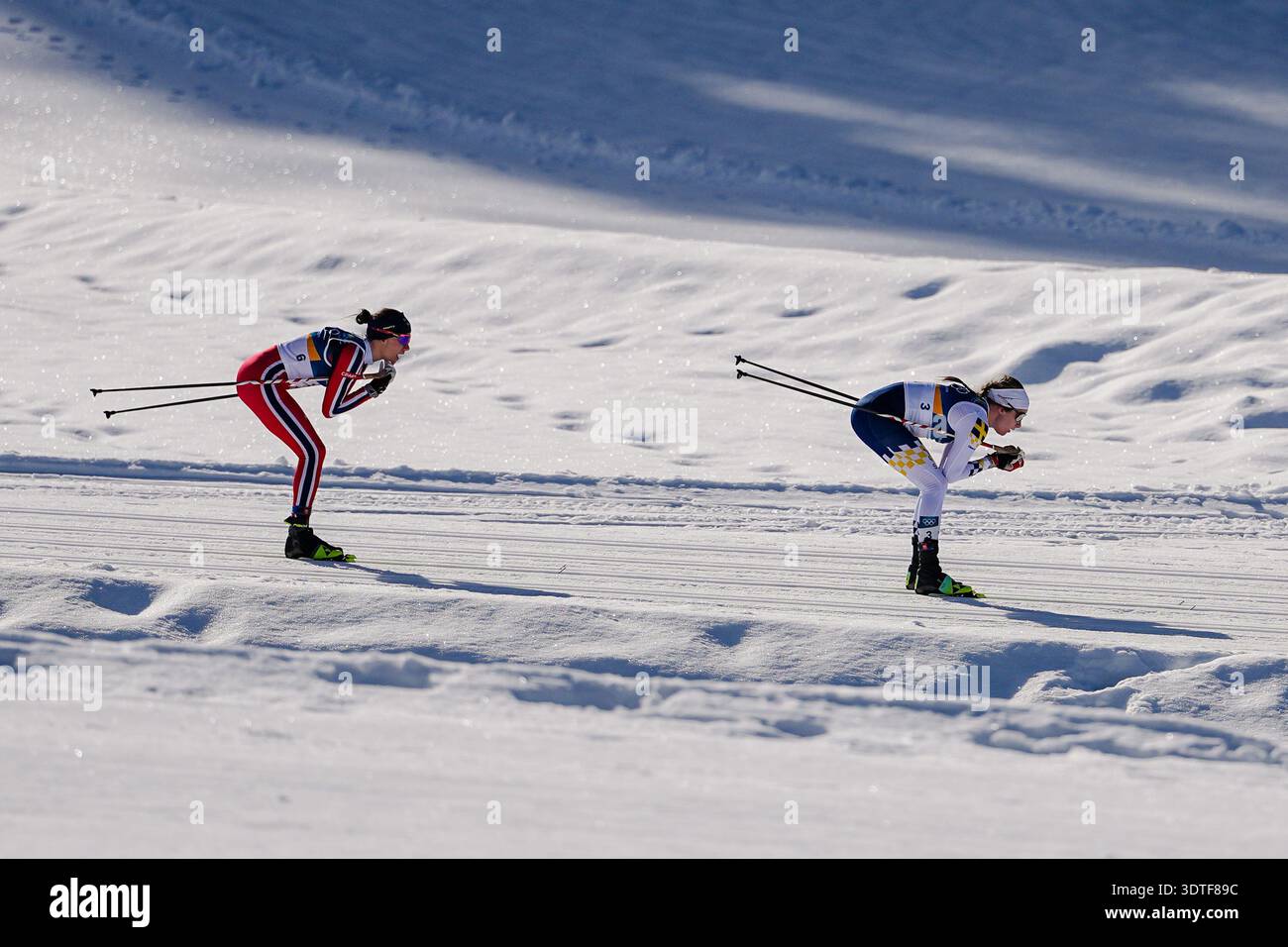 Ebba Andersson, of Sweden, right, and Heidi Weng, of Norway, compete in ...