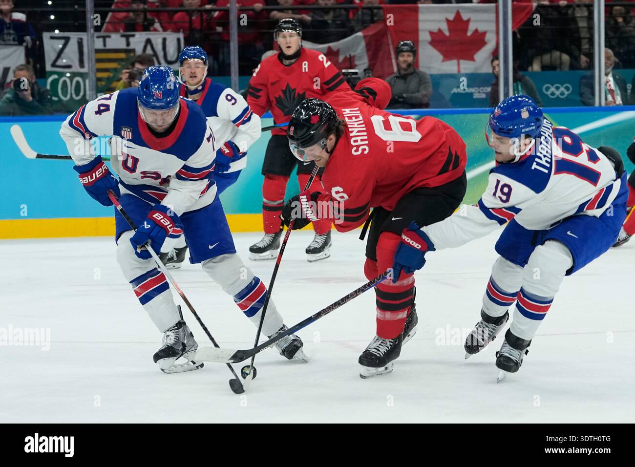 United States' Jaccob Slavin (74), Canada's Travis Sanheim (6) and ...