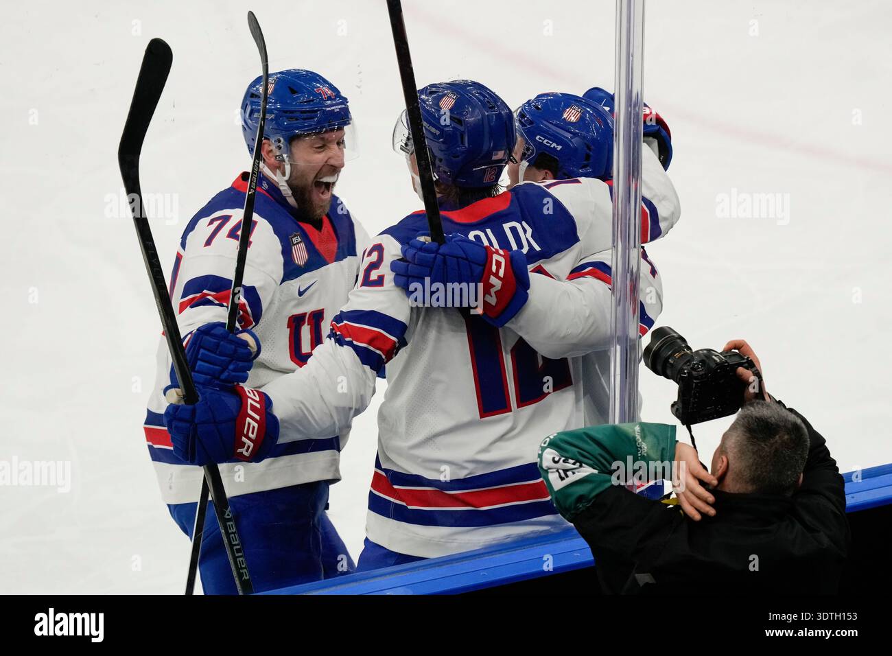 United States' Matt Boldy (12) celebrates with United States' Jaccob ...