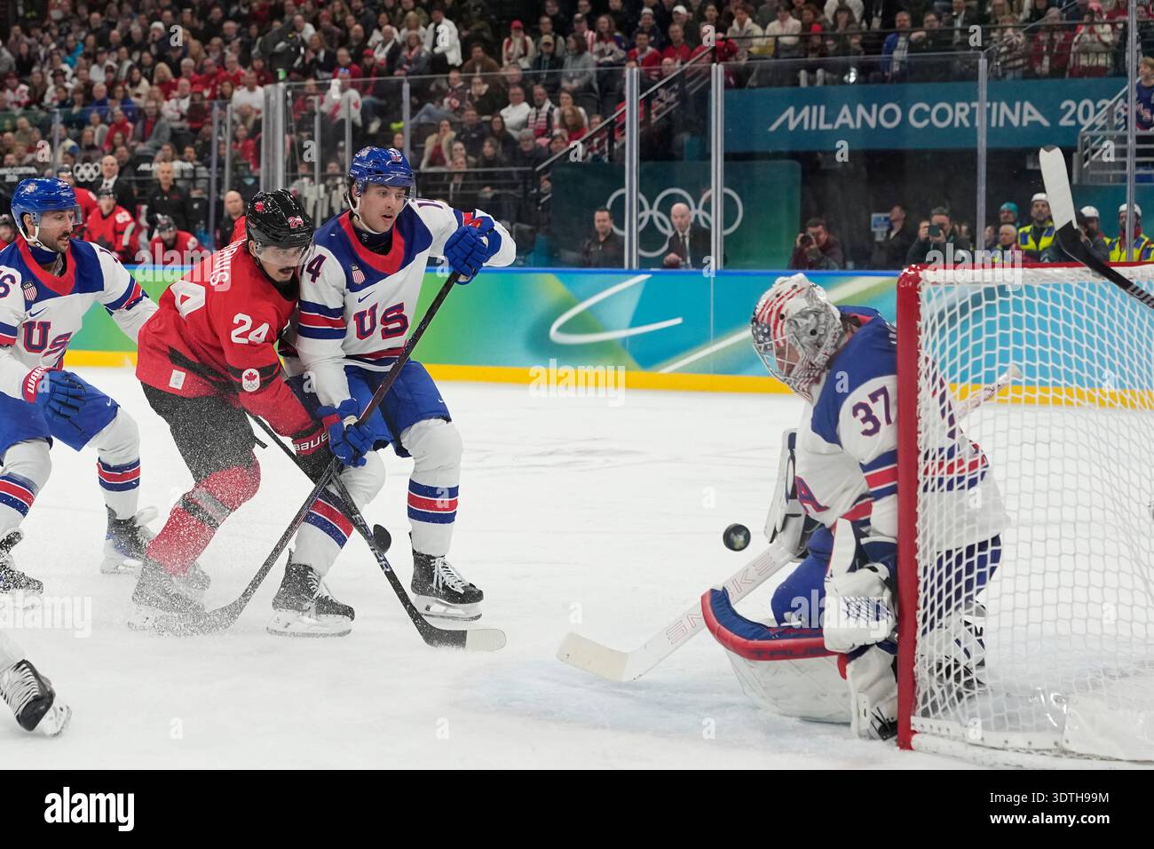 United States' Connor Hellebuyck (37) makes a save during a men's ice ...