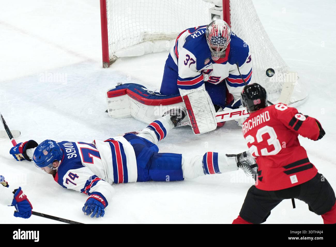 United States goalkeeper Connor Hellebuyck (37) and Jaccob Slavin (74 ...