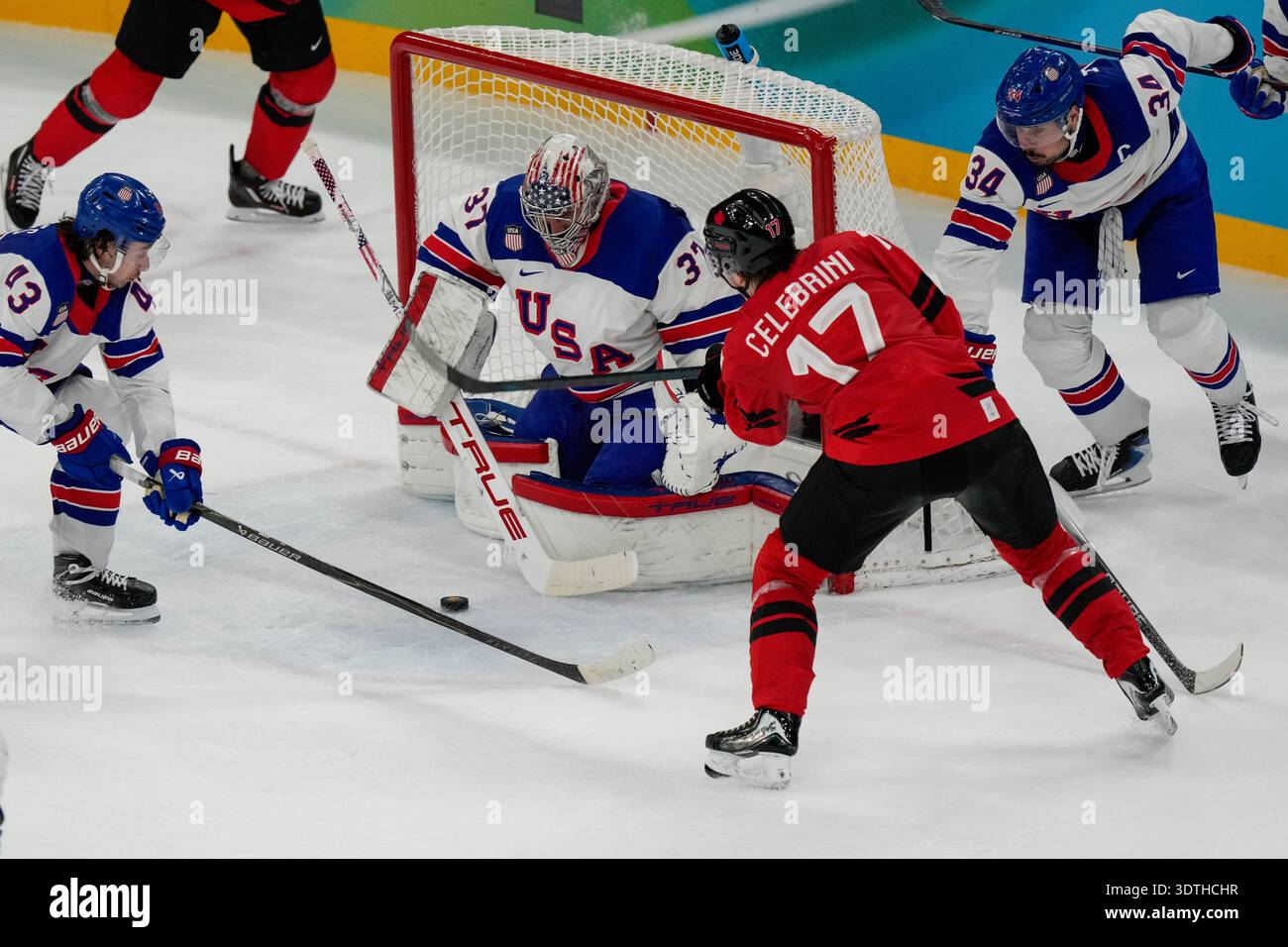 United States' Connor Hellebuyck (37) makes a save against Canada's ...