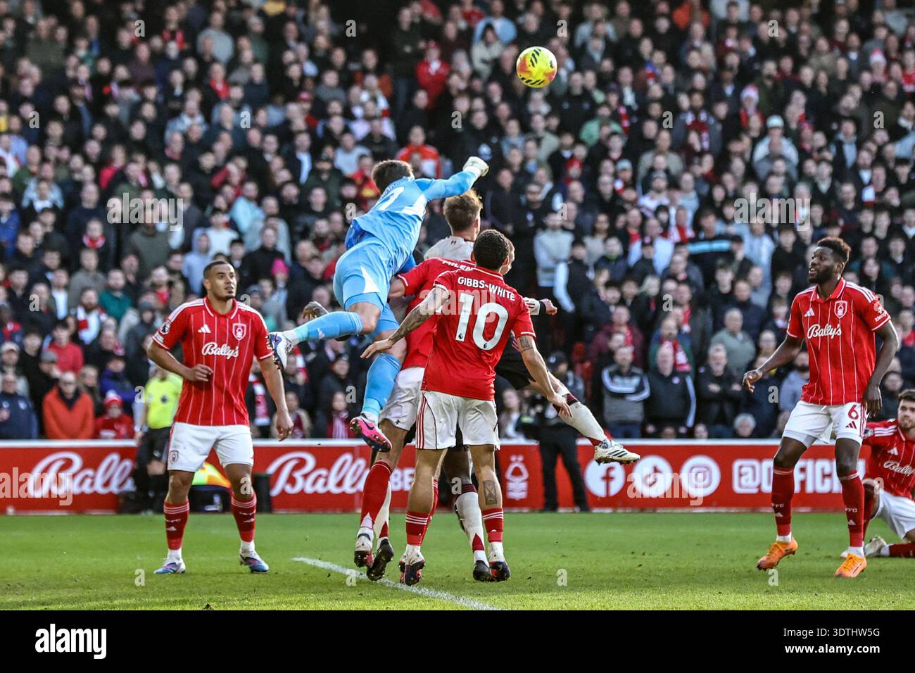 Nottingham Forest goalkeeper Stefan Ortega punches the ball clear ...