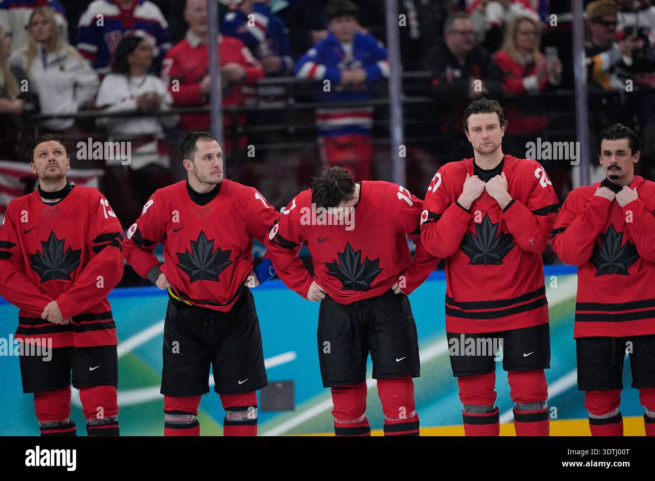 Canada players react after losing to the United States in a men's ice ...