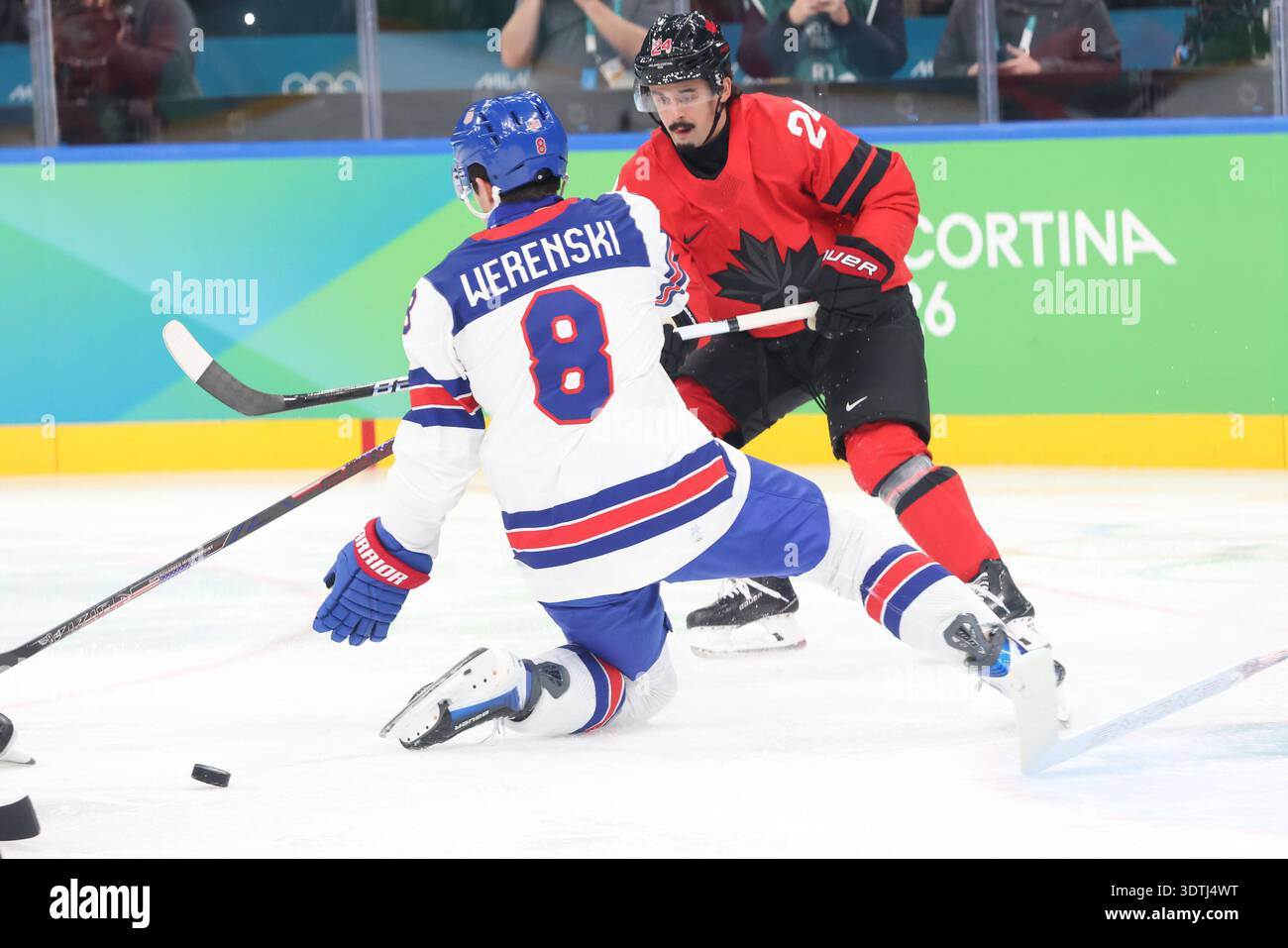 February 22, 2026: Seth Jarvis (24) of Canada looks to pass with Zach ...