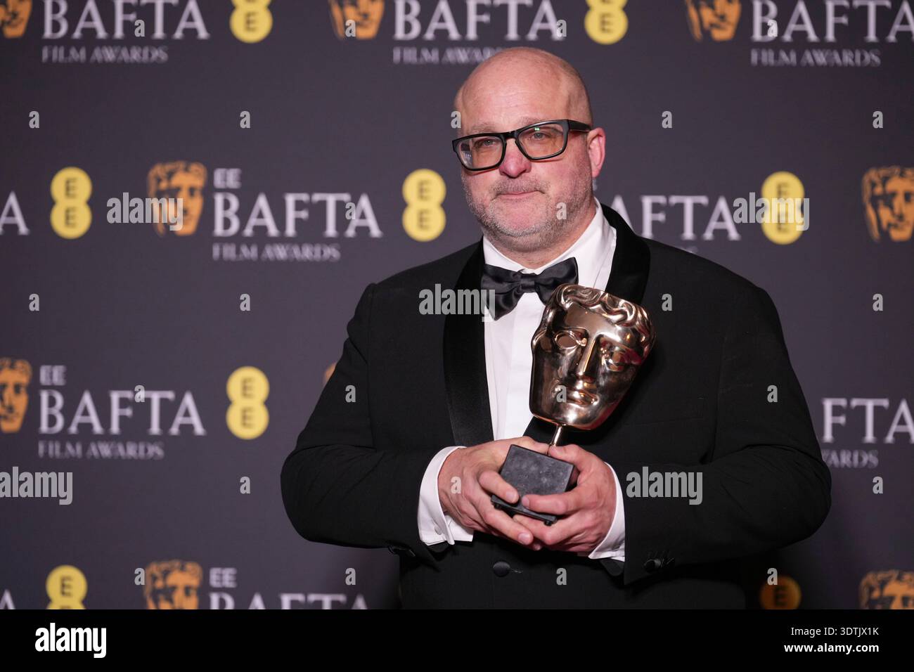 Michael Bauman poses with the award for cinematography for 'One Battle ...