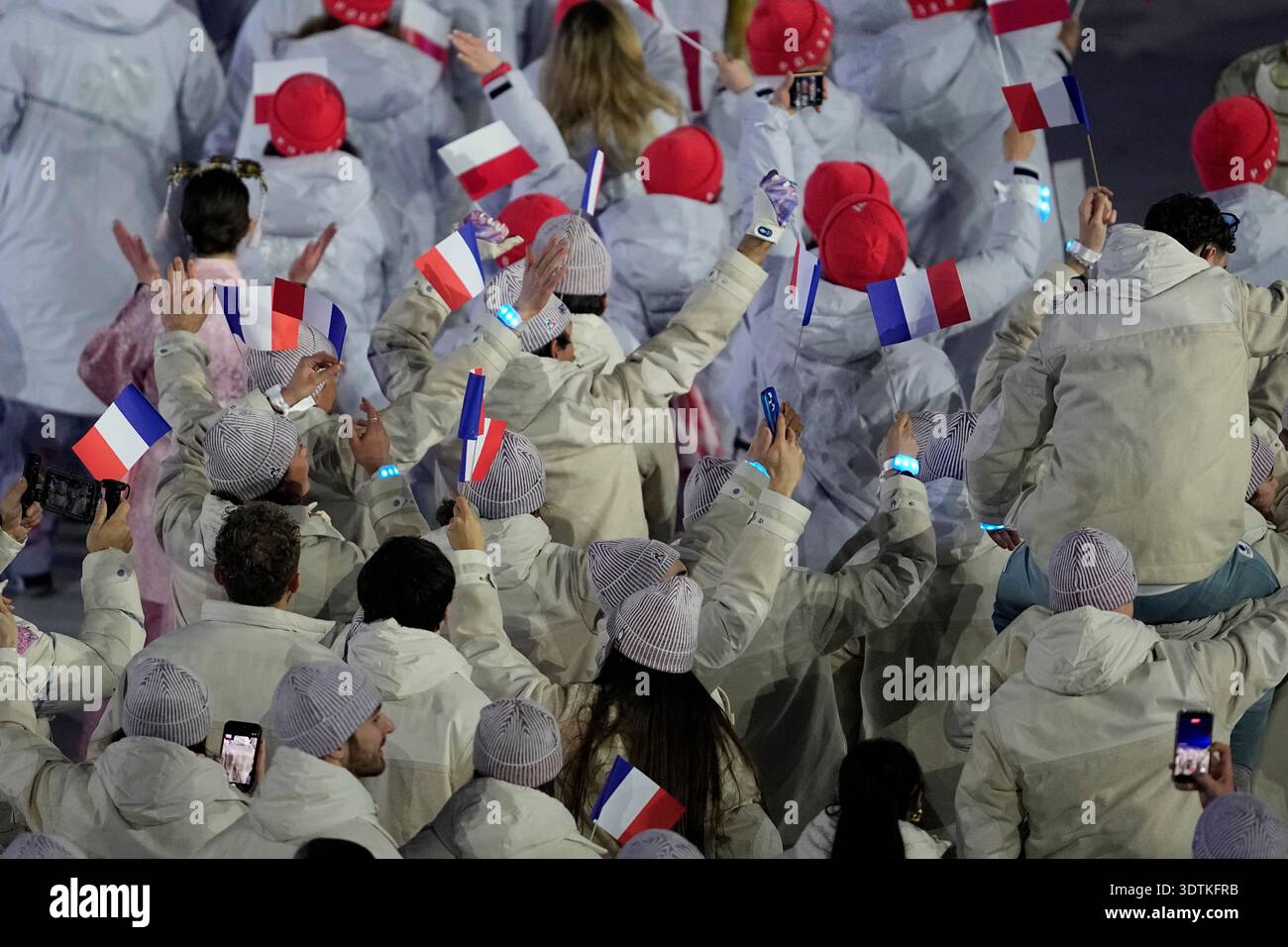 French athletes wave flags during the closing ceremony of the 2026 ...