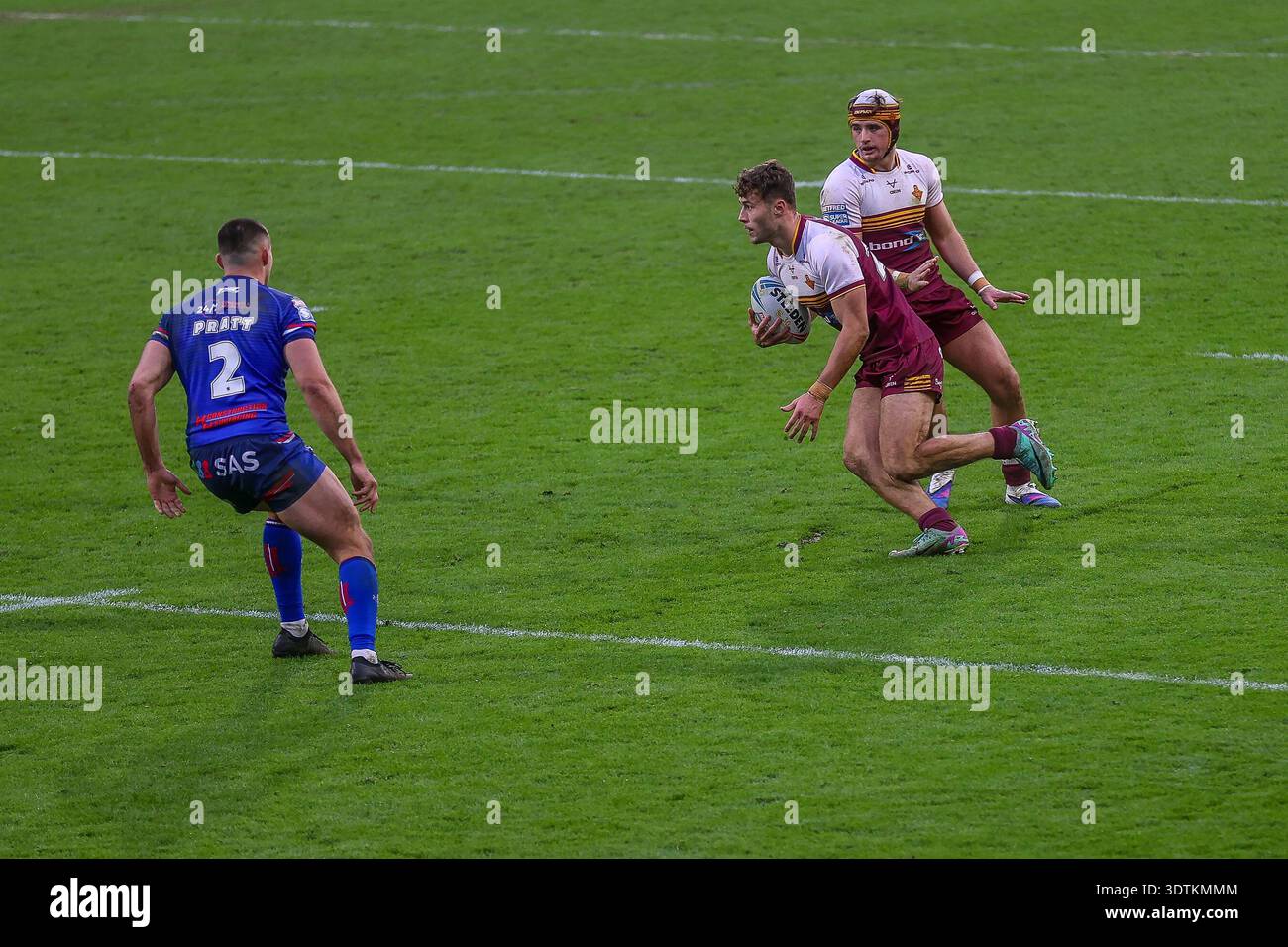Connor Carr runs at Oliver Pratt as George Flanagan looks on during the ...