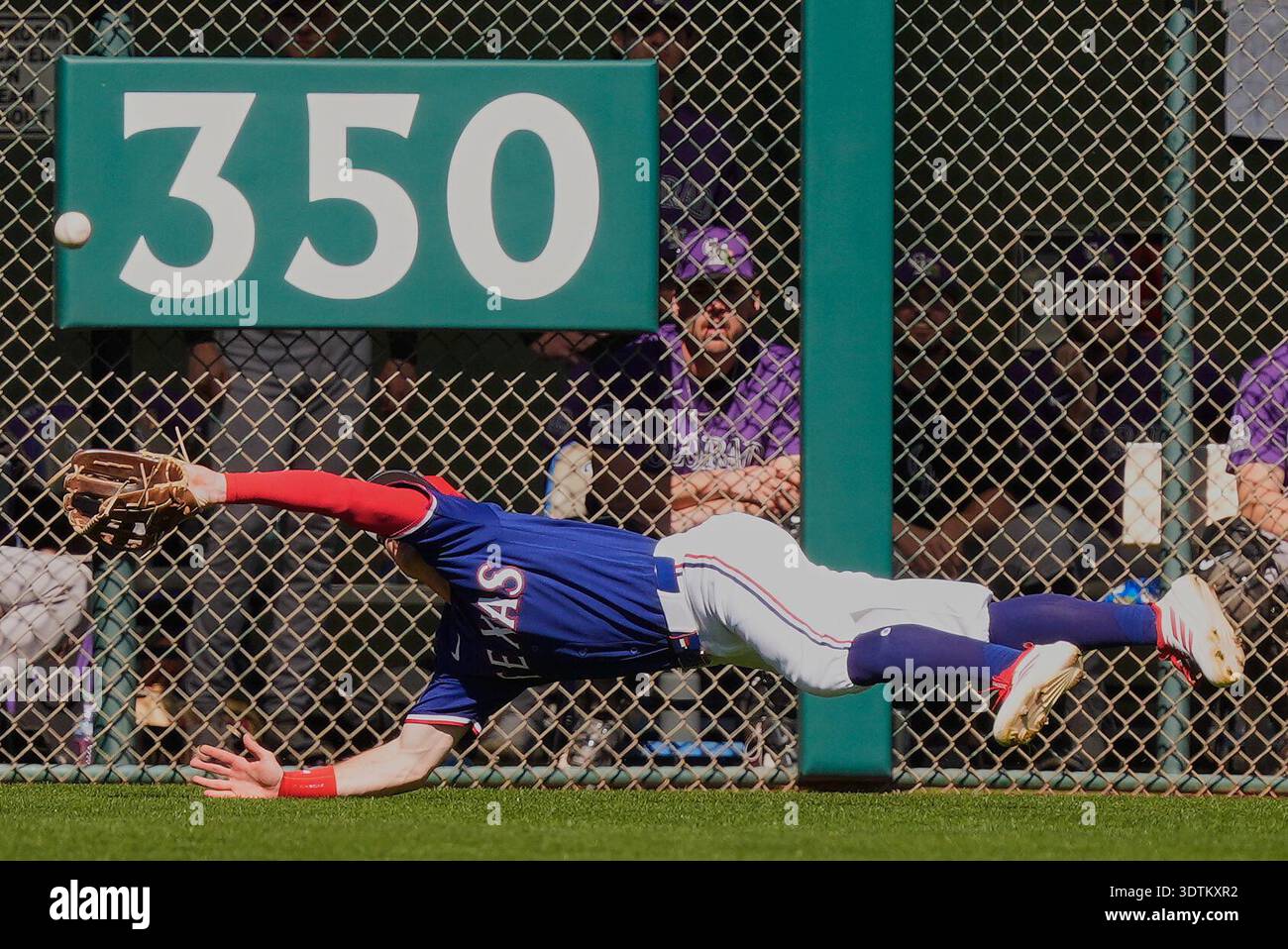 Texas Rangers left fielder Michael Helman can't catch a double hit by ...