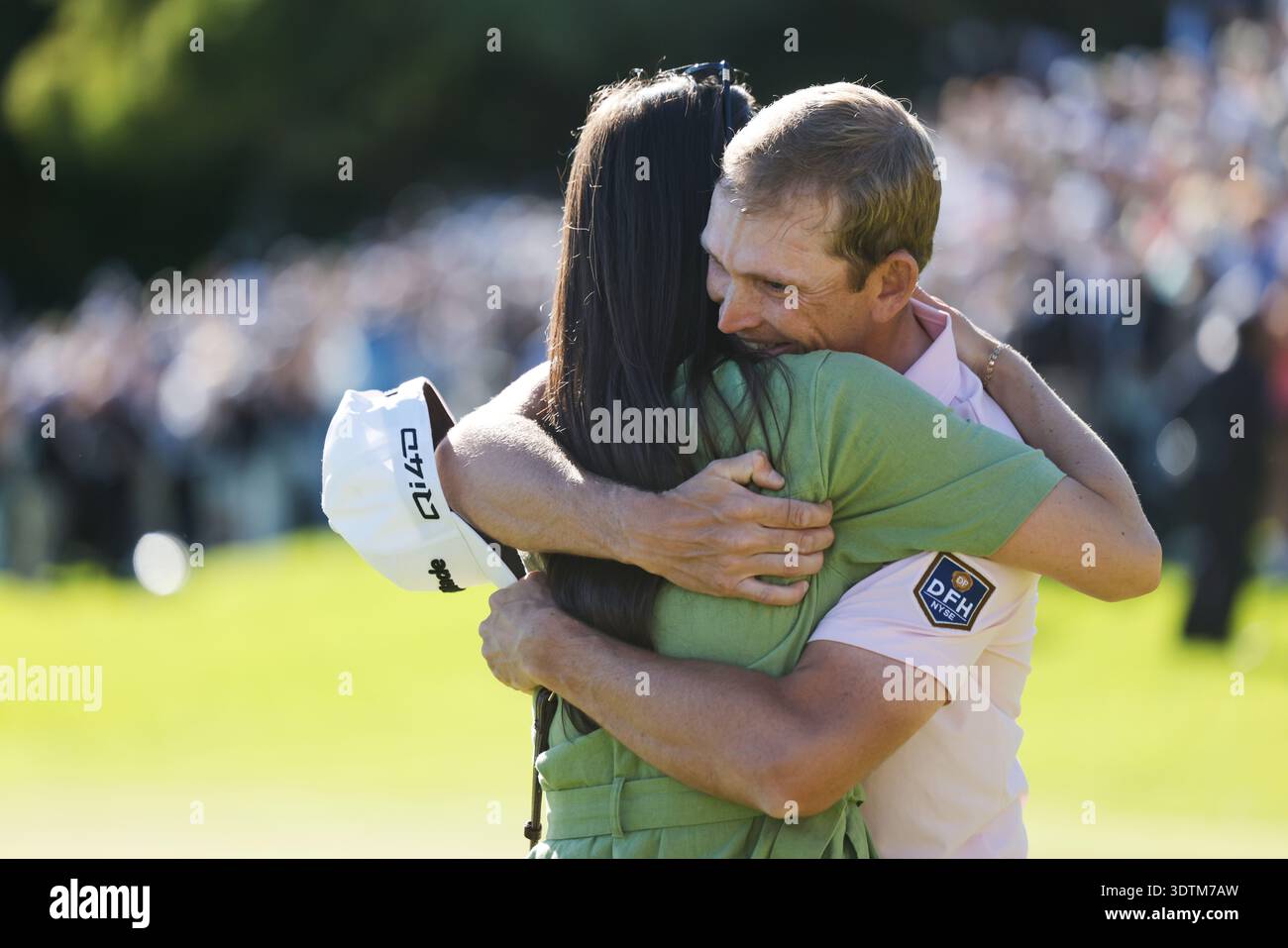 Jacob Bridgeman hugs his wife Haley after winning the Genesis ...