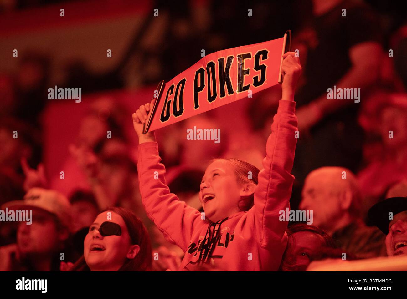 February 22, 2026, Stillwater, Oklahoma, USA: A fan holds ups a â€œGo ...