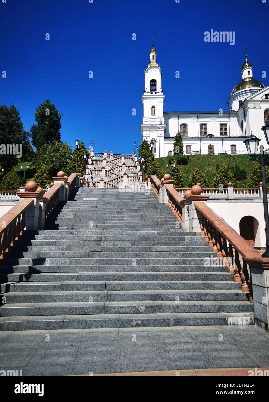 Wide granite steps rise toward a domed cathedral complex in Mogilev ...