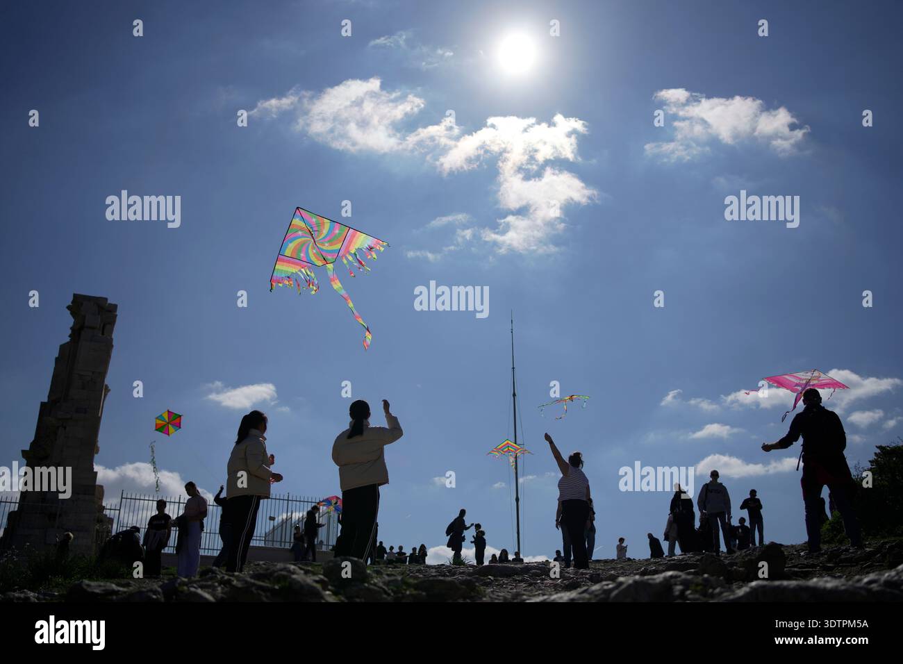 People try to fly kites on Clean Monday at Filopappou Hill in Athens ...