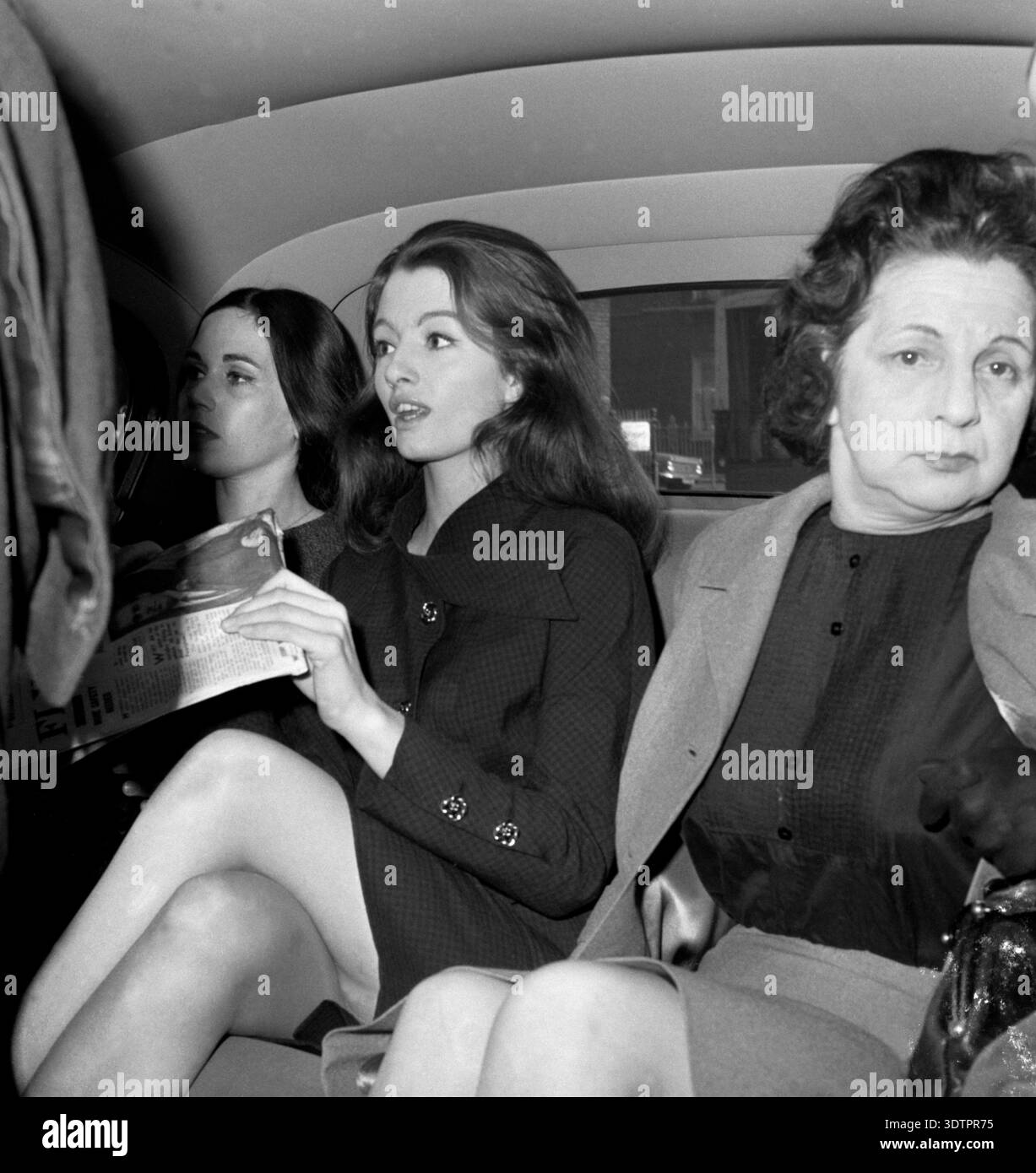 Christine Keeler, centre, her housekeeper Olive Brooker, right, and ...